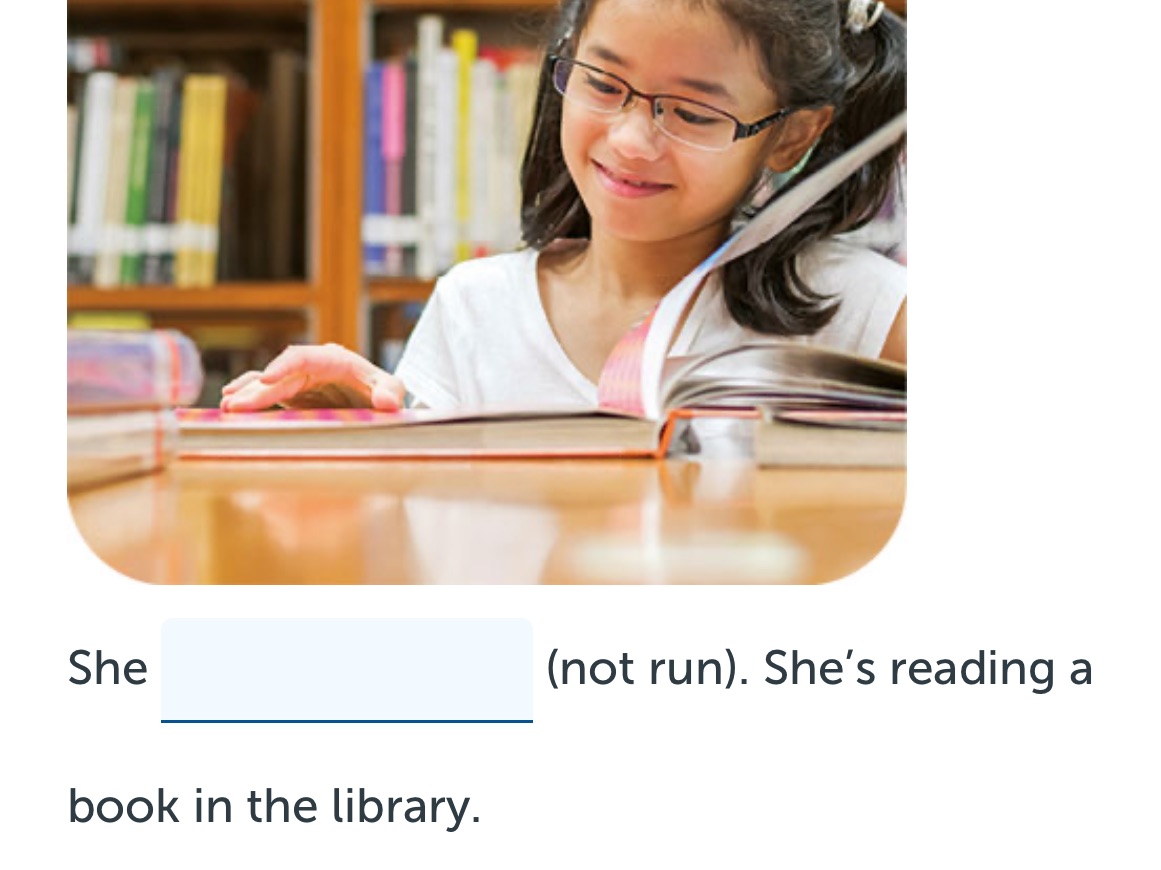 She (not run). She's reading a book in the