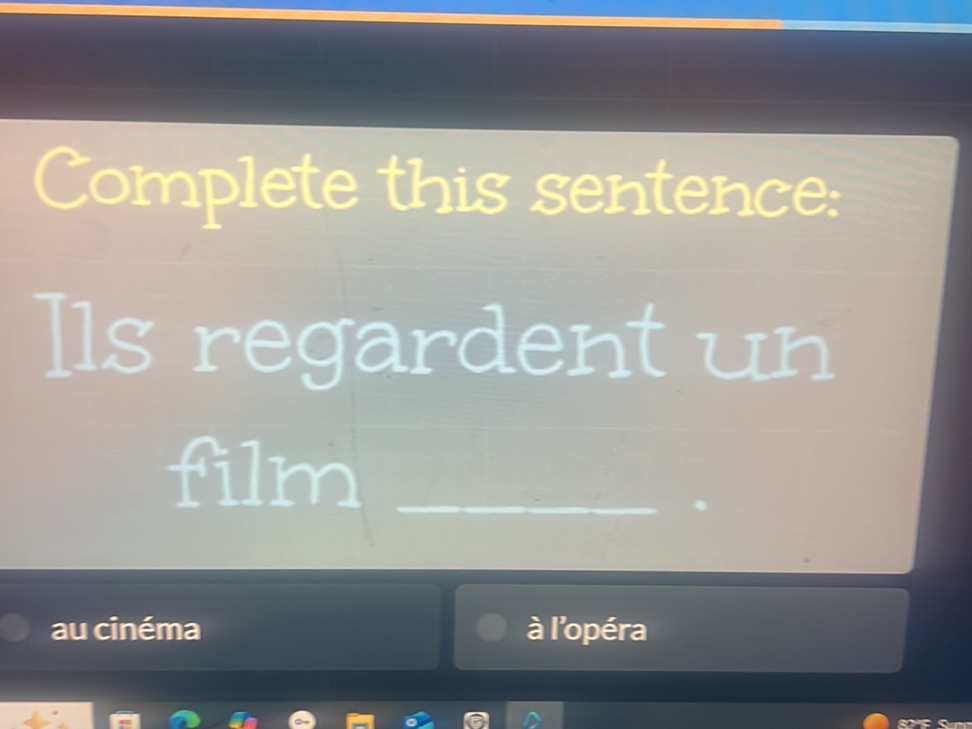 Complete this sentence: Ils regardent un | StudyX