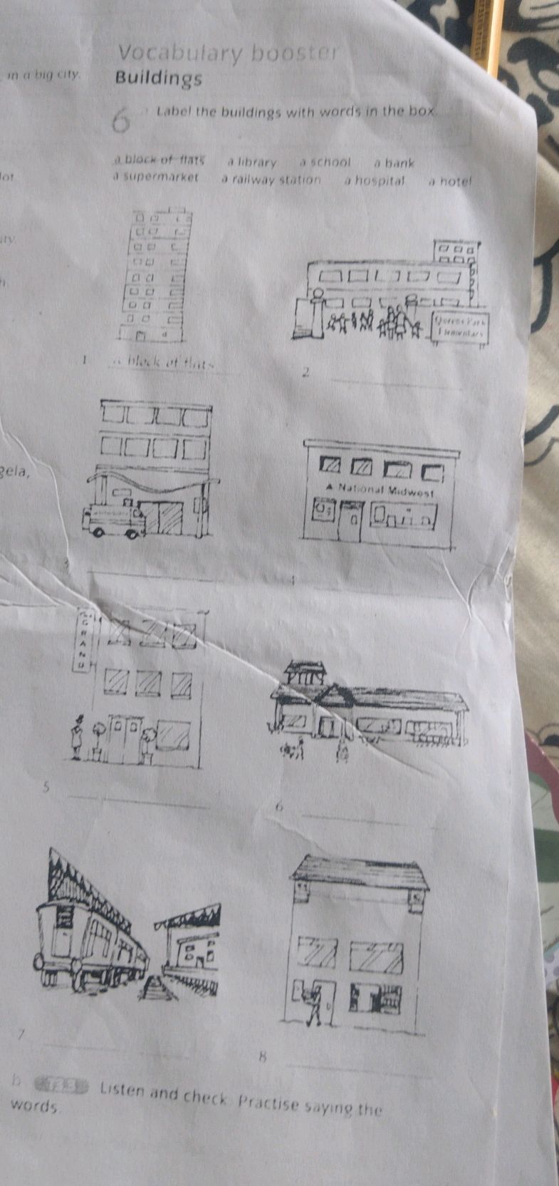 Label the buildings with words in the box. a