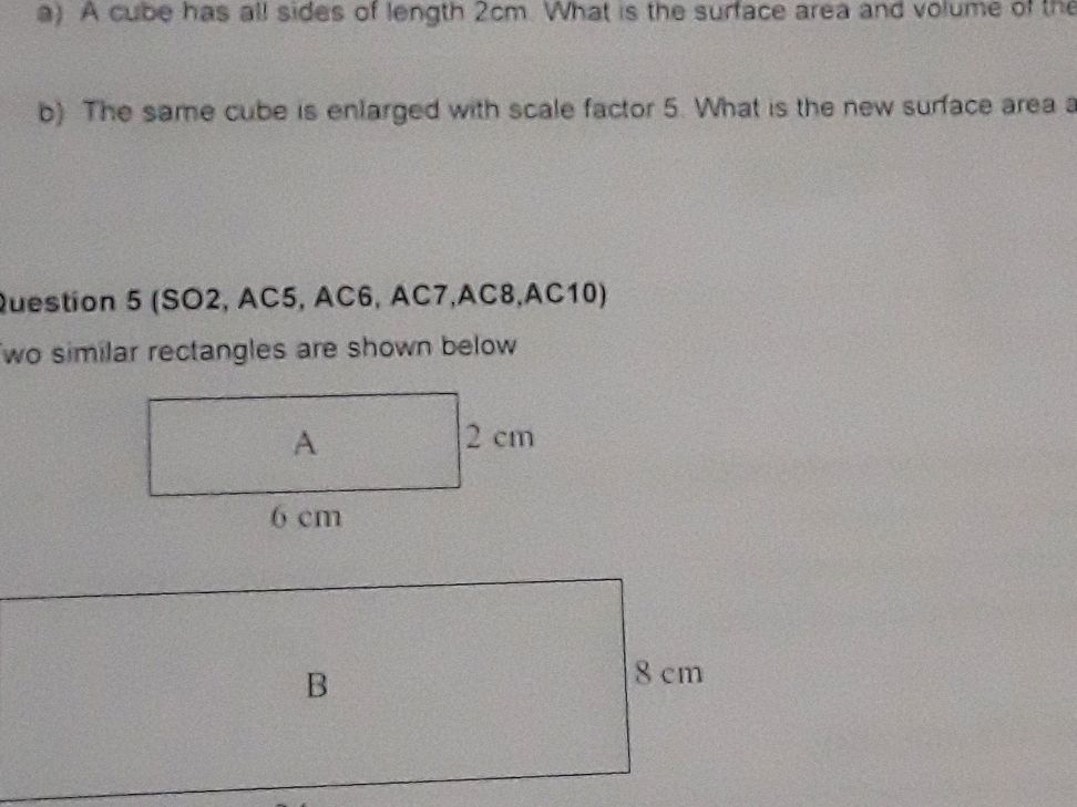 a) A cube has all sides of length 2cm. What