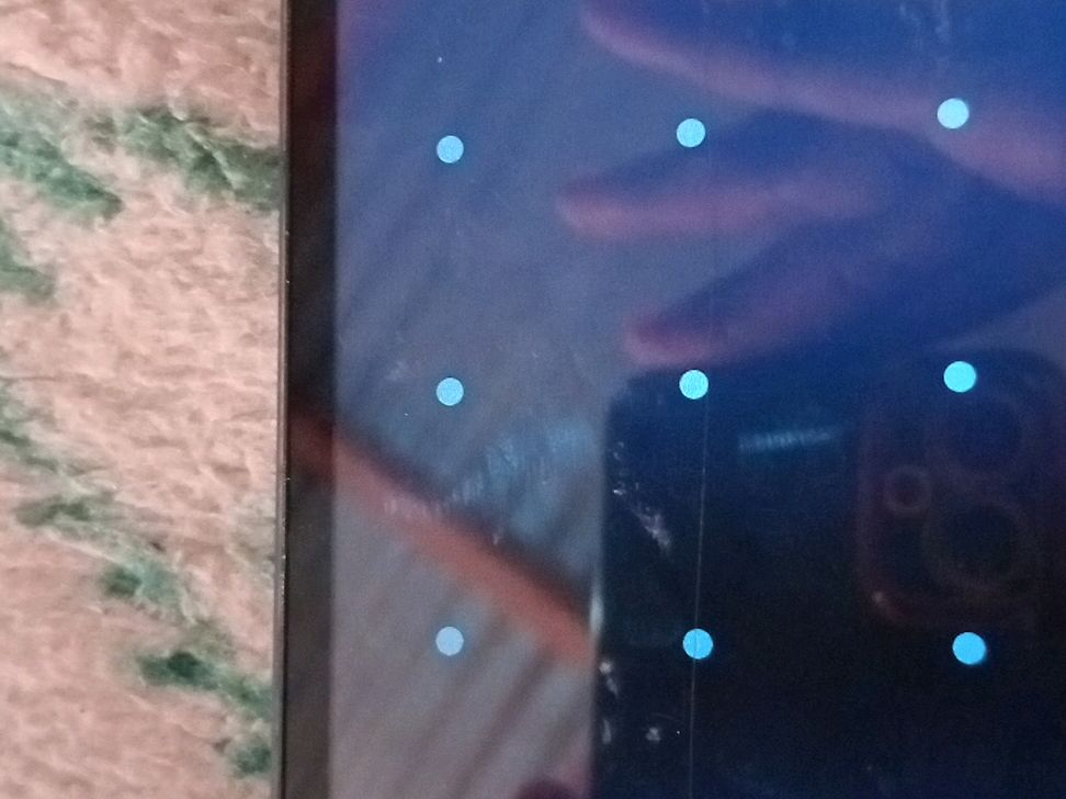 The image shows a pattern lock screen on a | StudyX