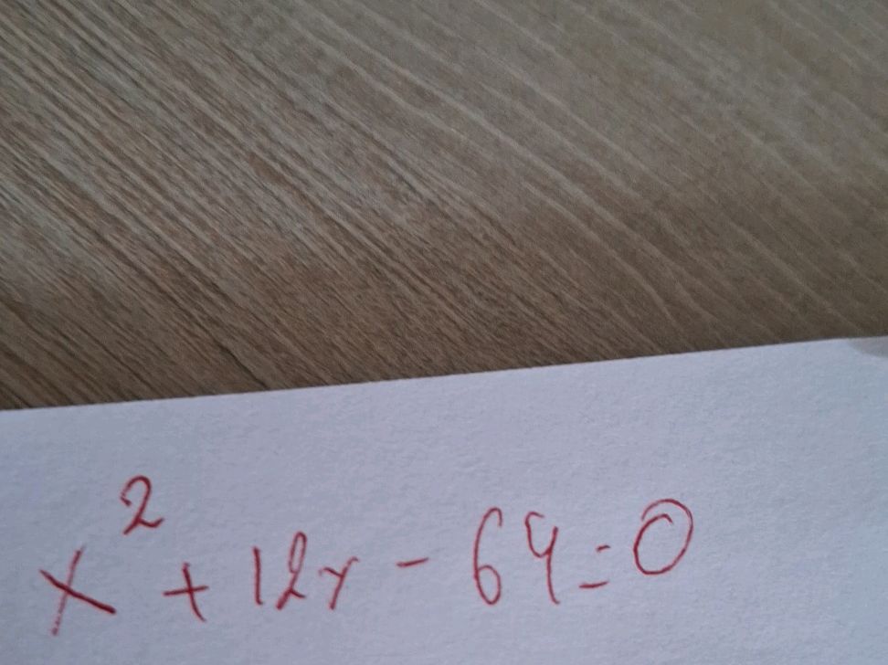 Solve quadratic equation x^2 + 12x - 69 = 0 | StudyX