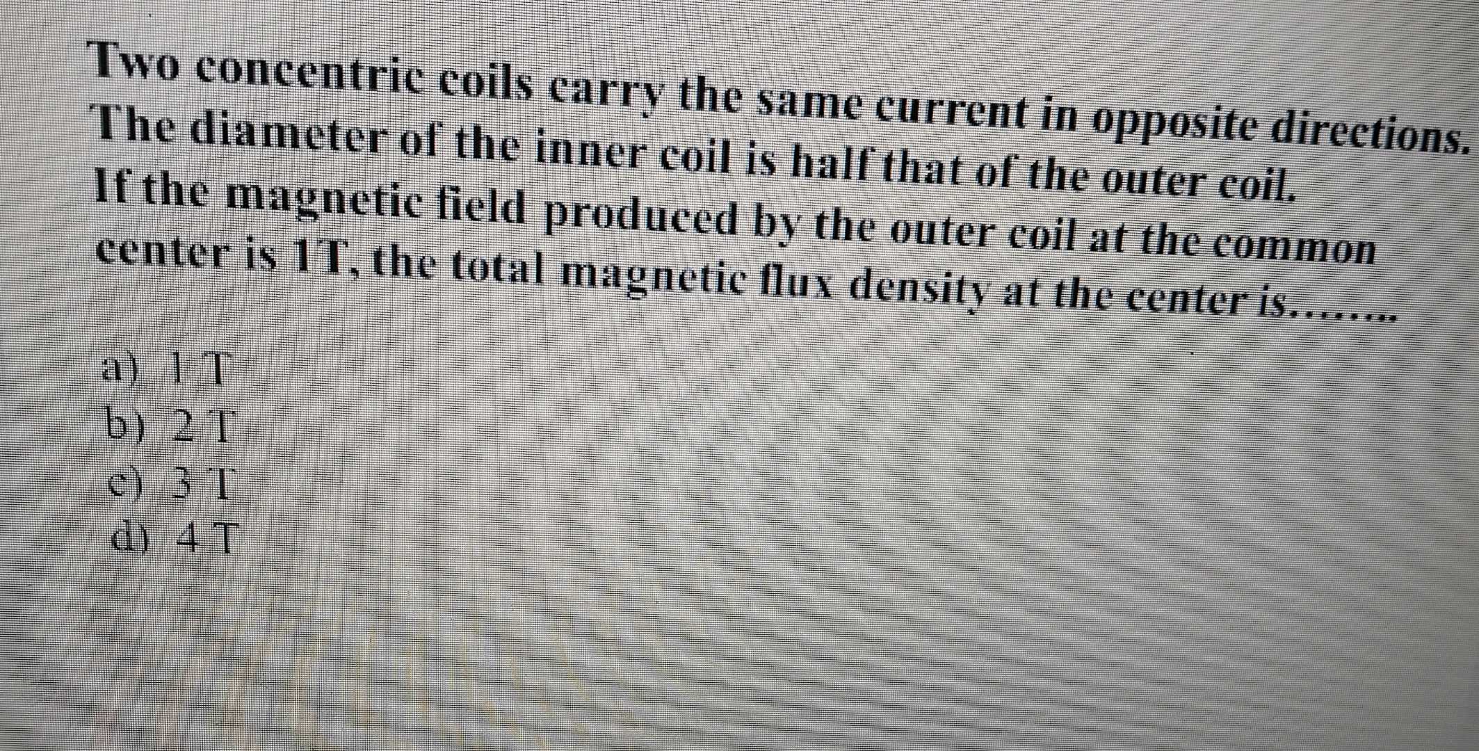 Two concentric coils carry the same current | StudyX