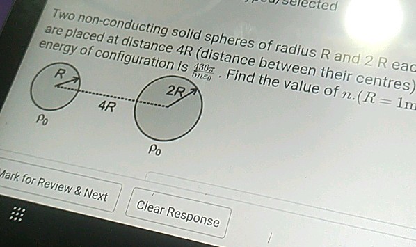Two non-conducting solid spheres of radius | StudyX