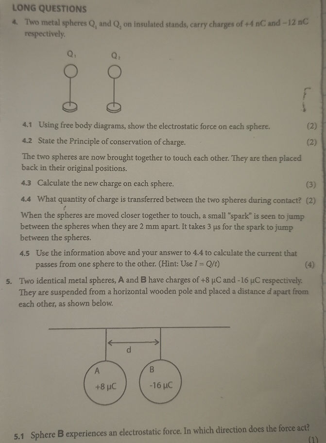 4. Two metal spheres $Q_1$ and $Q_2$ on | StudyX