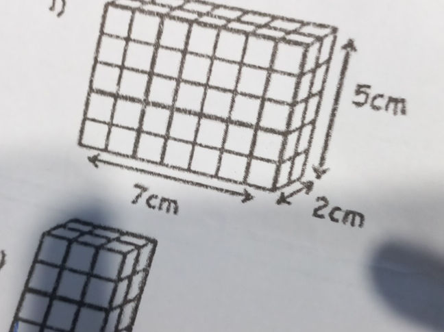 The image shows a rectangular prism made up | StudyX