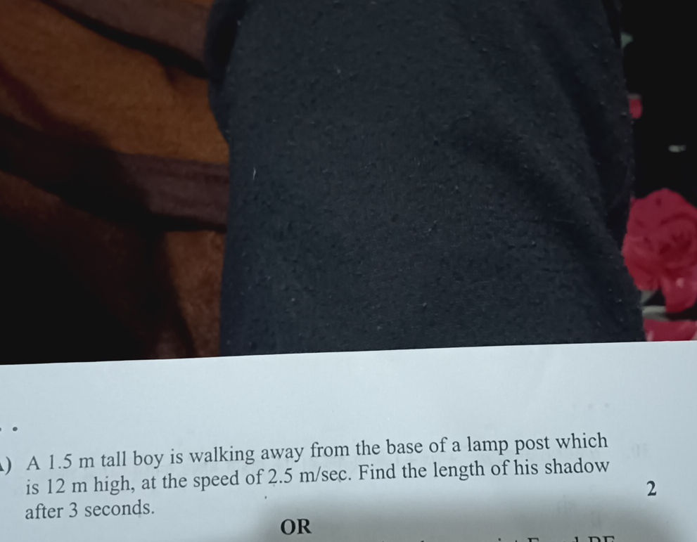 A 1.5 m tall boy is walking away from the