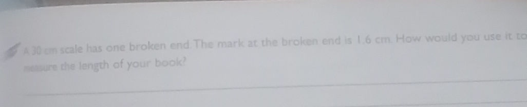 A 30 cm scale has one broken end. The mark