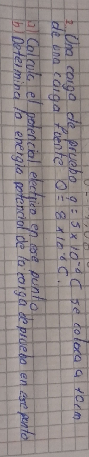 2. Una carga de prueba $q = 5 10^{-6} C$ | StudyX