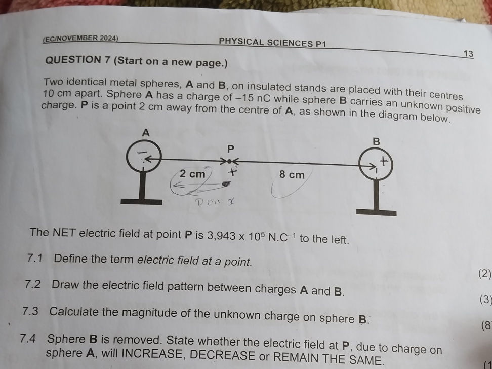 Two identical metal spheres, A and B, on | StudyX
