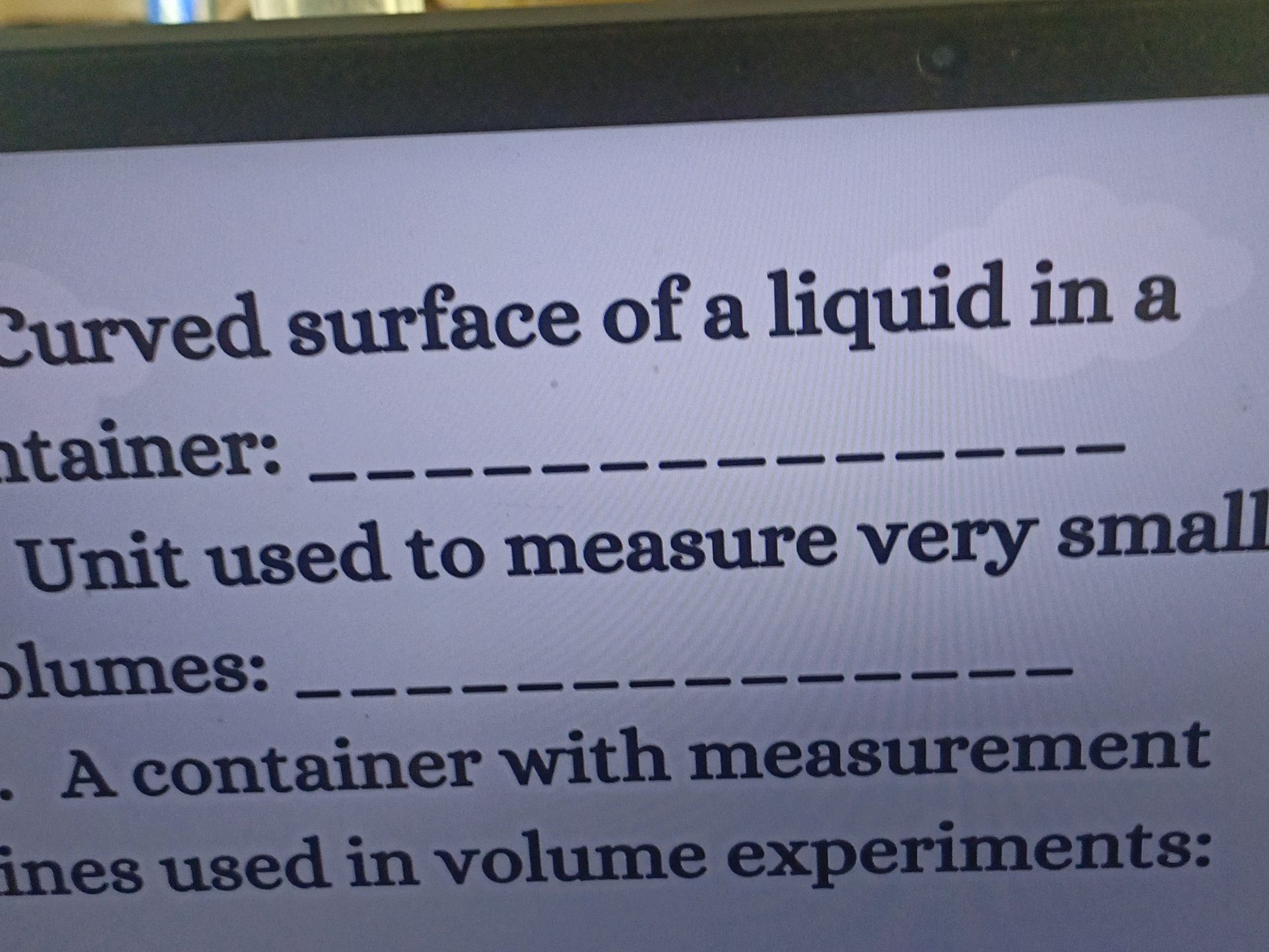 Curved surface of a liquid in a container: | StudyX