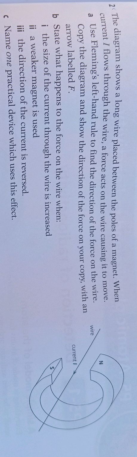 2 The diagram shows a long wire placed | StudyX