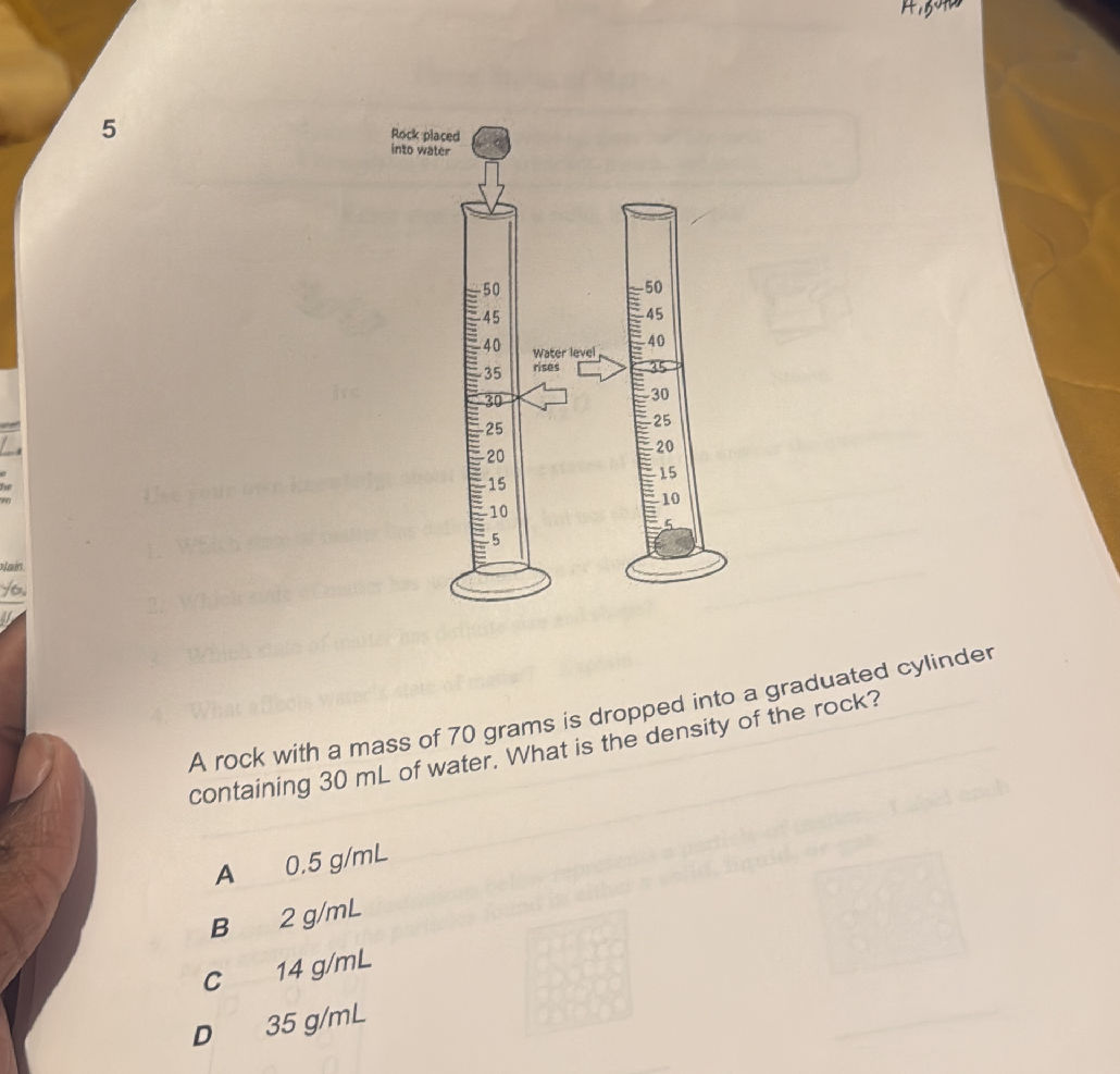 A rock with a mass of $70$ grams is dropped | StudyX
