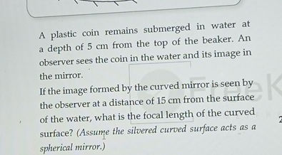 A plastic coin remains submerged in water at