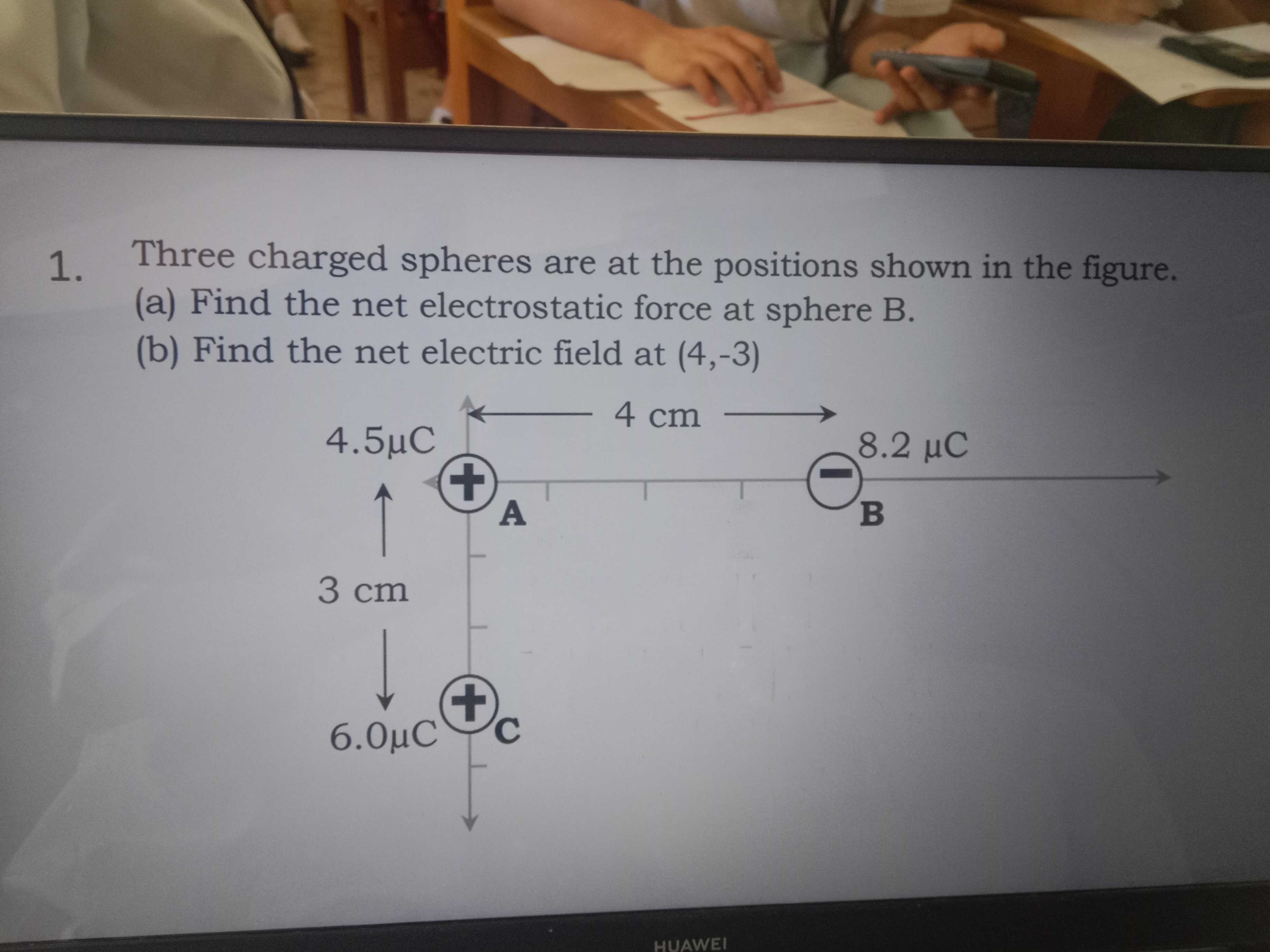1 Three charged spheres are at the positions | StudyX