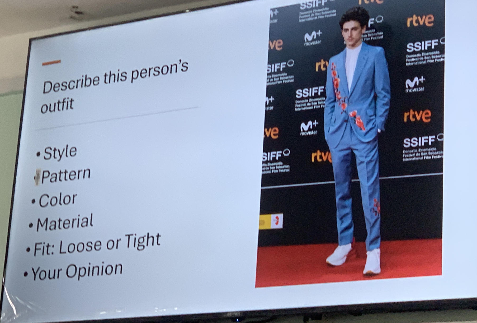 Describe this person's outfit * Style * | StudyX