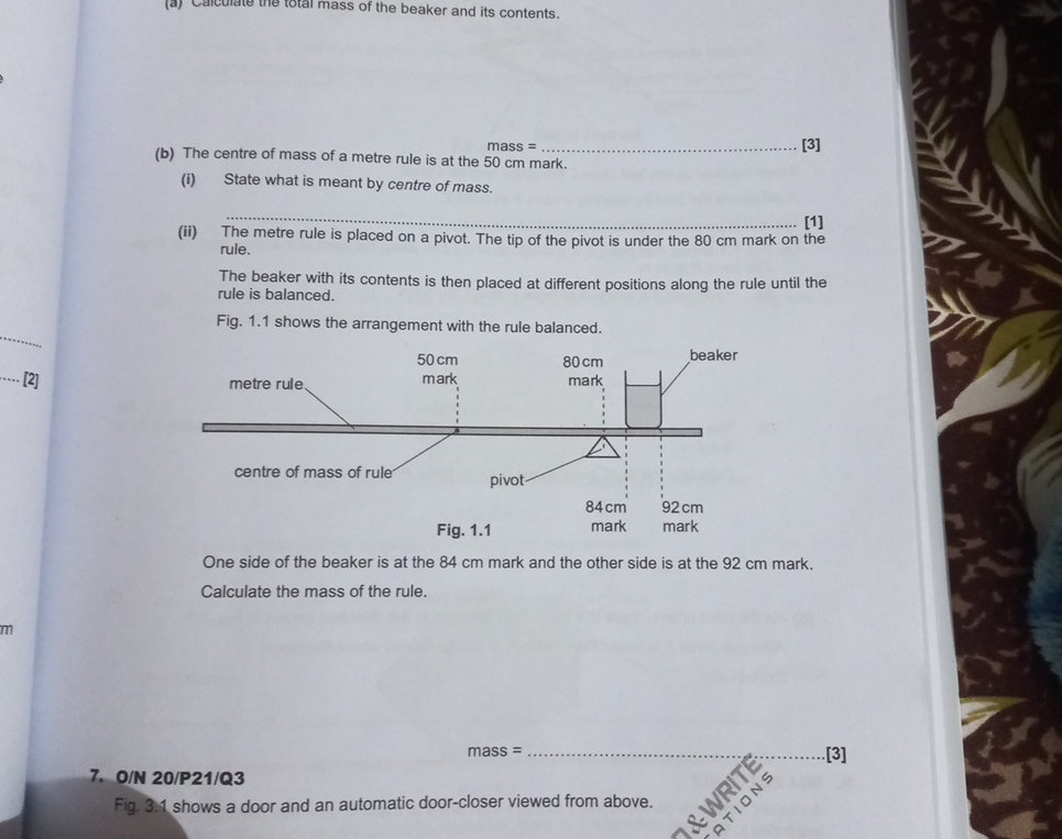 (b) The centre of mass of a metre rule is at | StudyX