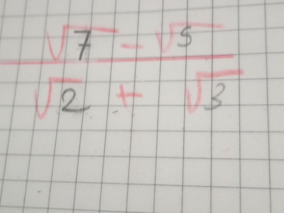 Simplify radical expression: (√7 - √5) / (√2 | StudyX