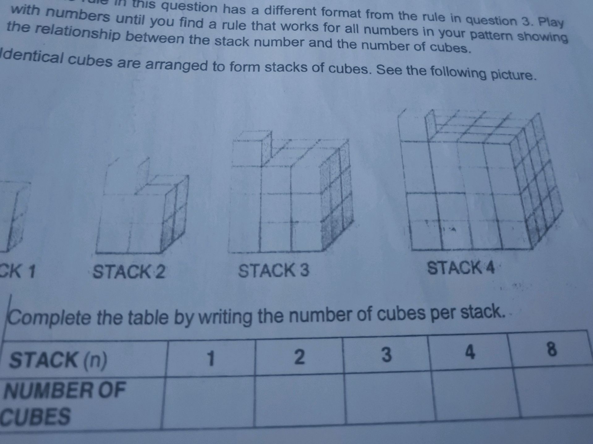 Identical cubes are arranged to form stacks | StudyX