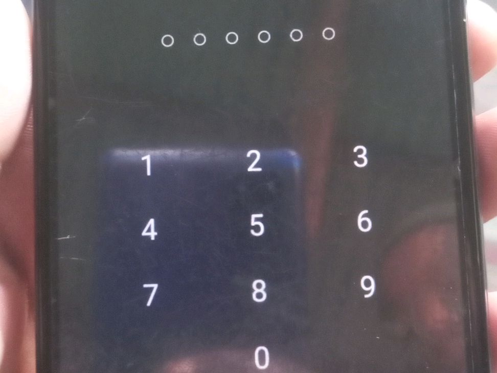 The image shows a phone's keypad with | StudyX