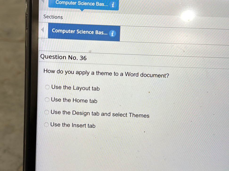 How do you apply a theme to a Word document? | StudyX